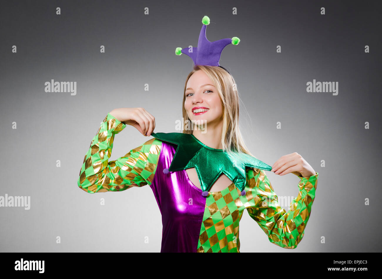 Funny clown in colourful costume Stock Photo - Alamy