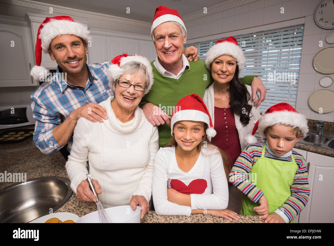 Multi-generation family baking together Stock Photo - Alamy