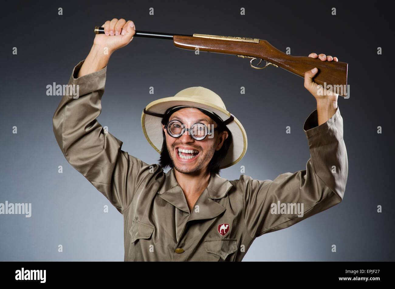 Funny safari hunter with rifle Stock Photo - Alamy