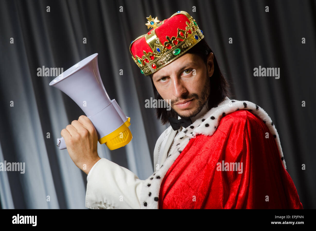 King with loudspeaker in funny concept Stock Photo - Alamy