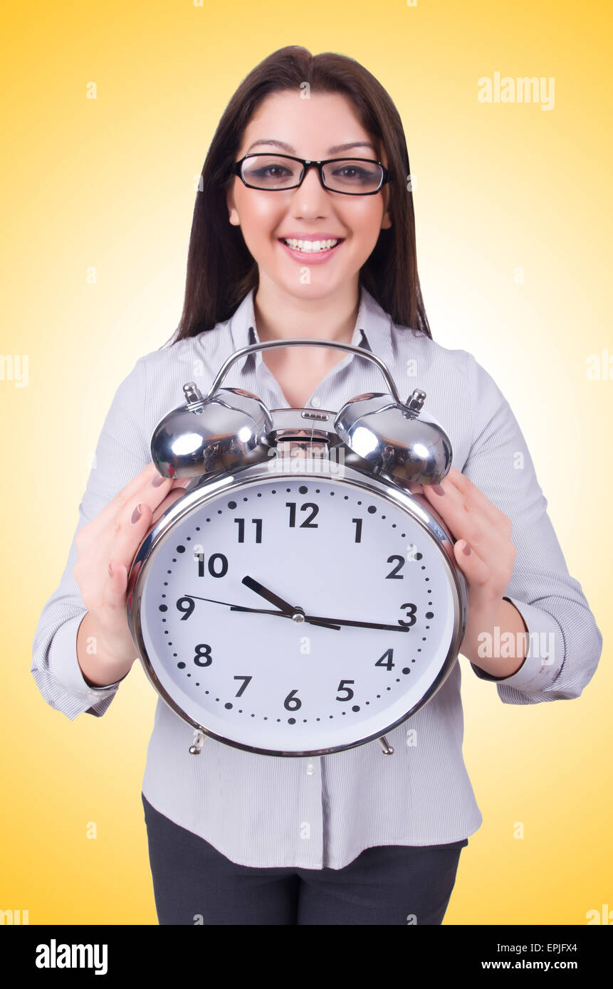 Woman with clock isolated on white Stock Photo - Alamy