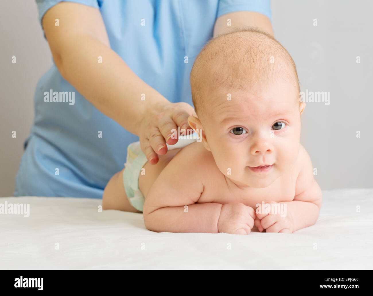 Little baby with doctor on table Stock Photo - Alamy