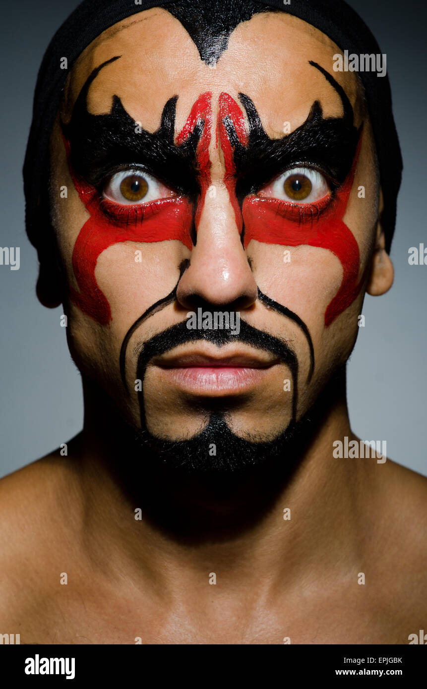 Man with face covered with facepaint Stock Photo - Alamy