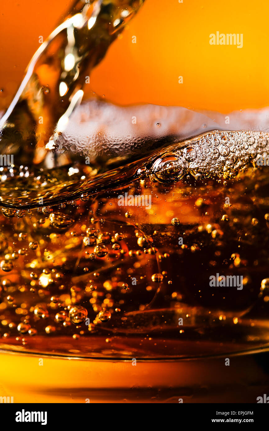 detail of an alcoholic beverage on yellow background Stock Photo - Alamy