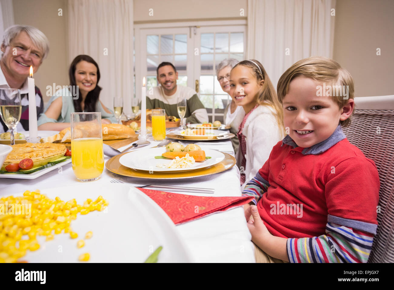 Three generation family having christmas dinner together Stock Photo ...