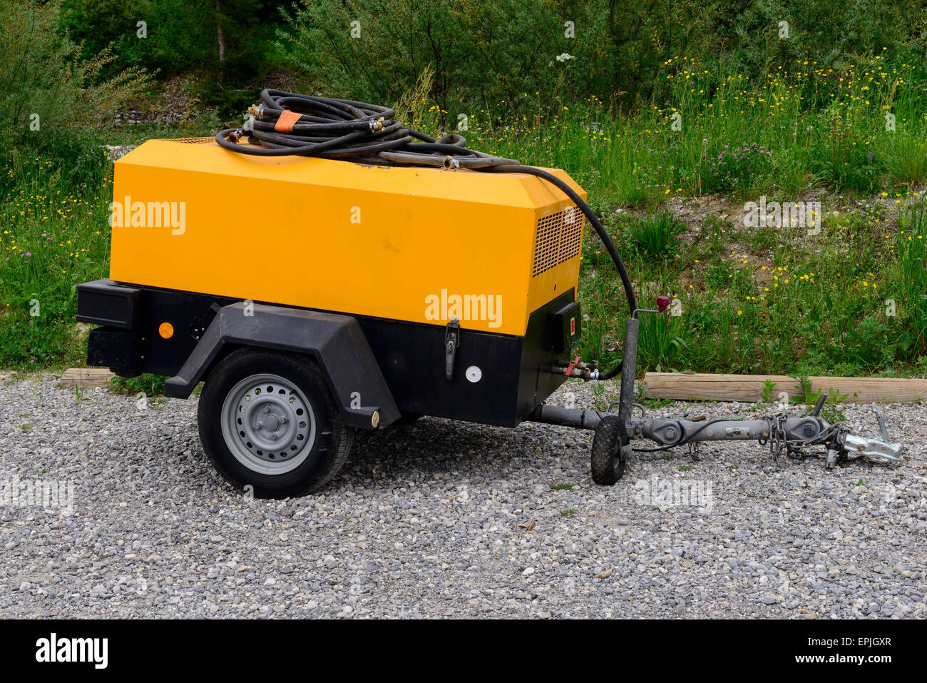 a yellow compressor site Stock Photo - Alamy