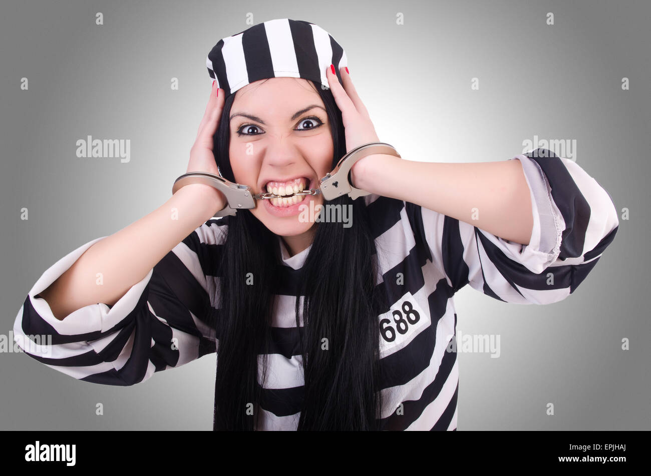 Prisoner in striped uniform on white Stock Photo - Alamy