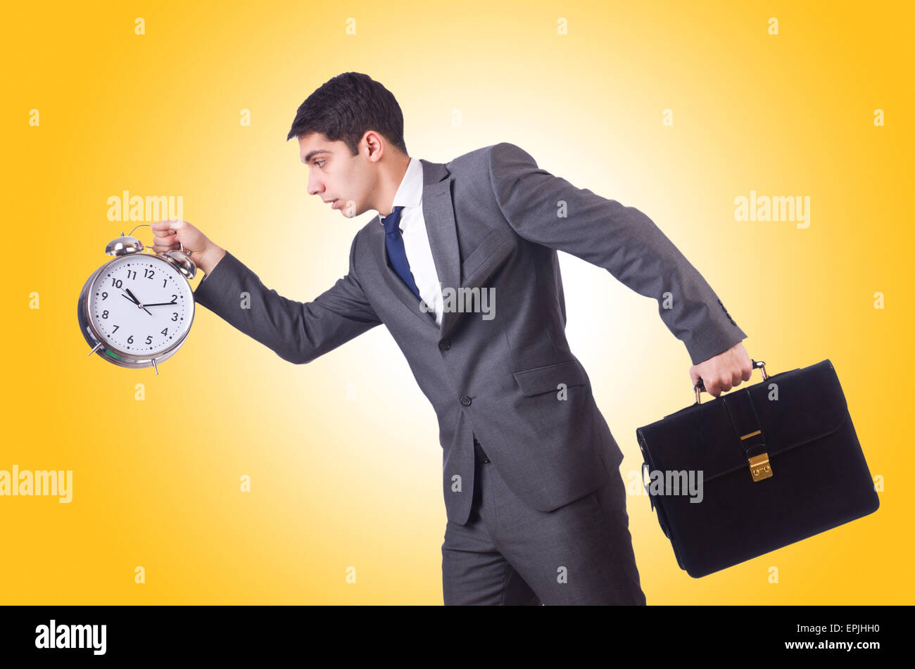 Businessman with clock isolated on white Stock Photo - Alamy