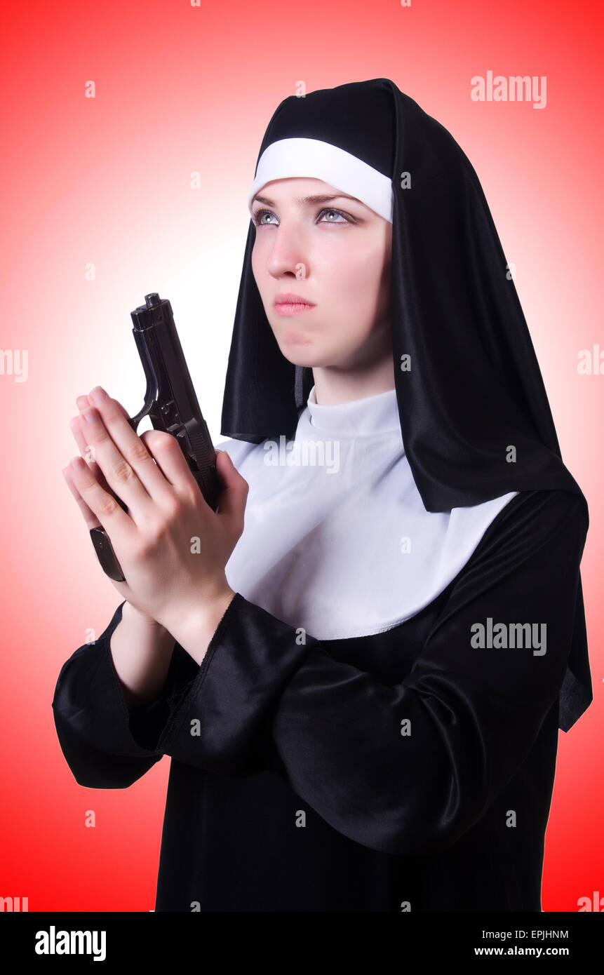 Nun with handgun isolated on white Stock Photo - Alamy