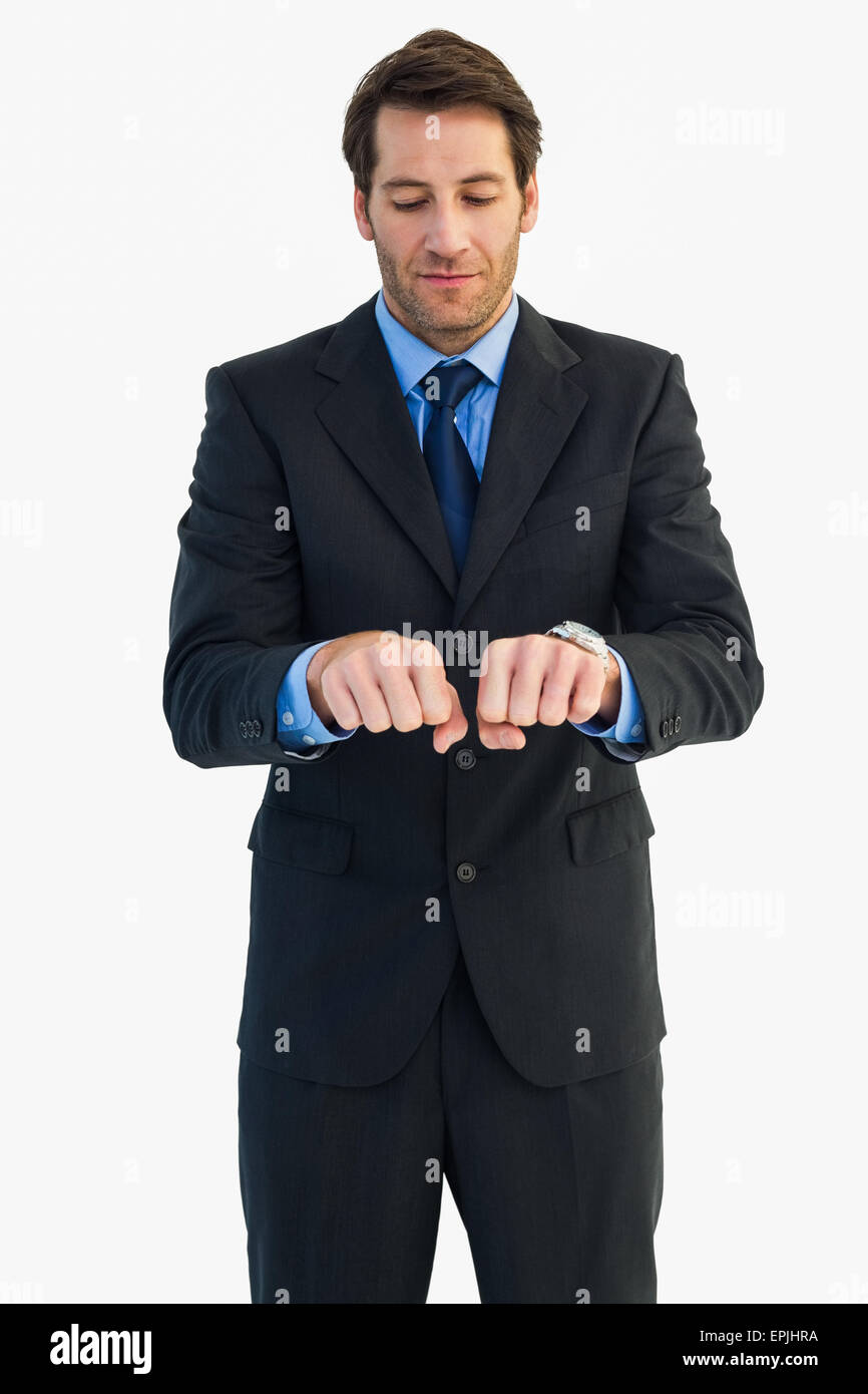 Businessman raising his clenched fists in front of him Stock Photo - Alamy