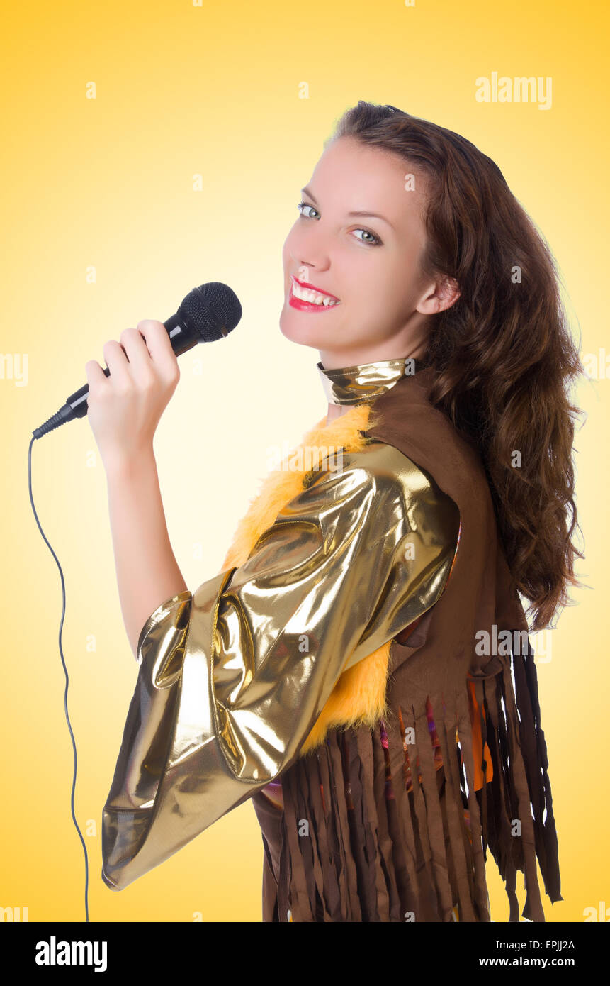 Woman in spanish clothing with mic Stock Photo - Alamy