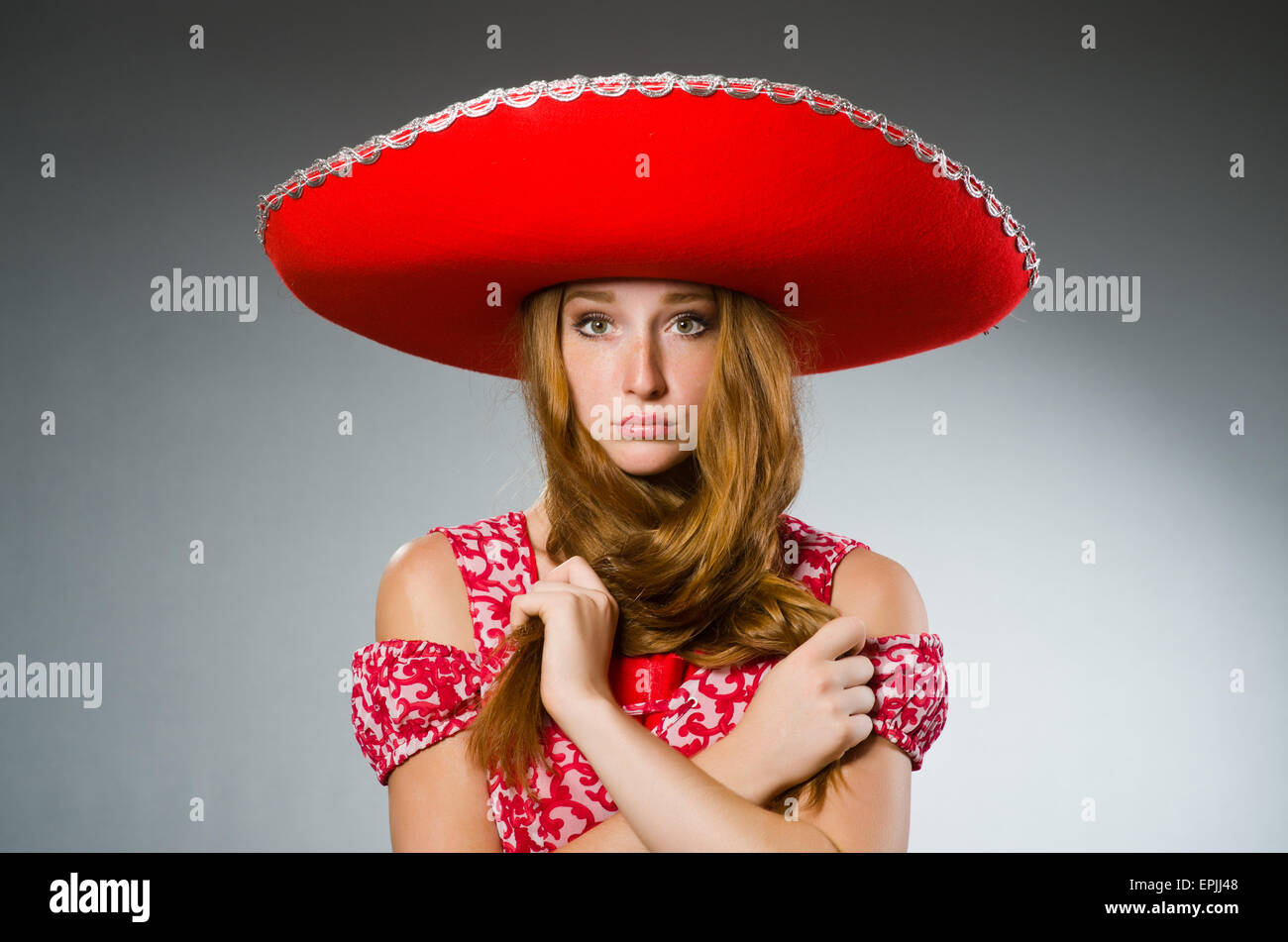 Mexican woman wearing red sombrero Stock Photo - Alamy