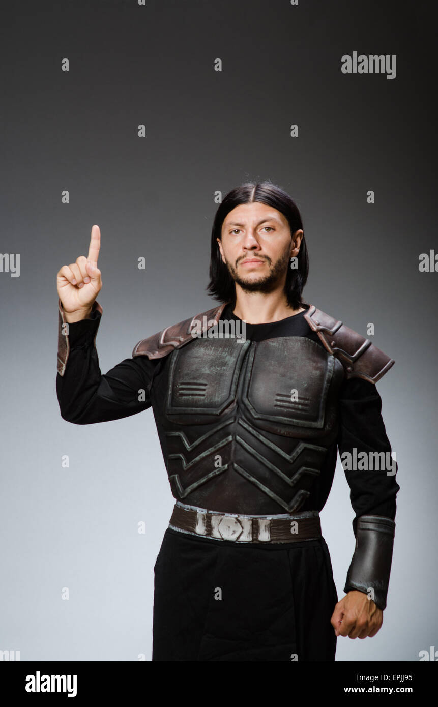 Funny knight against dark background Stock Photo - Alamy
