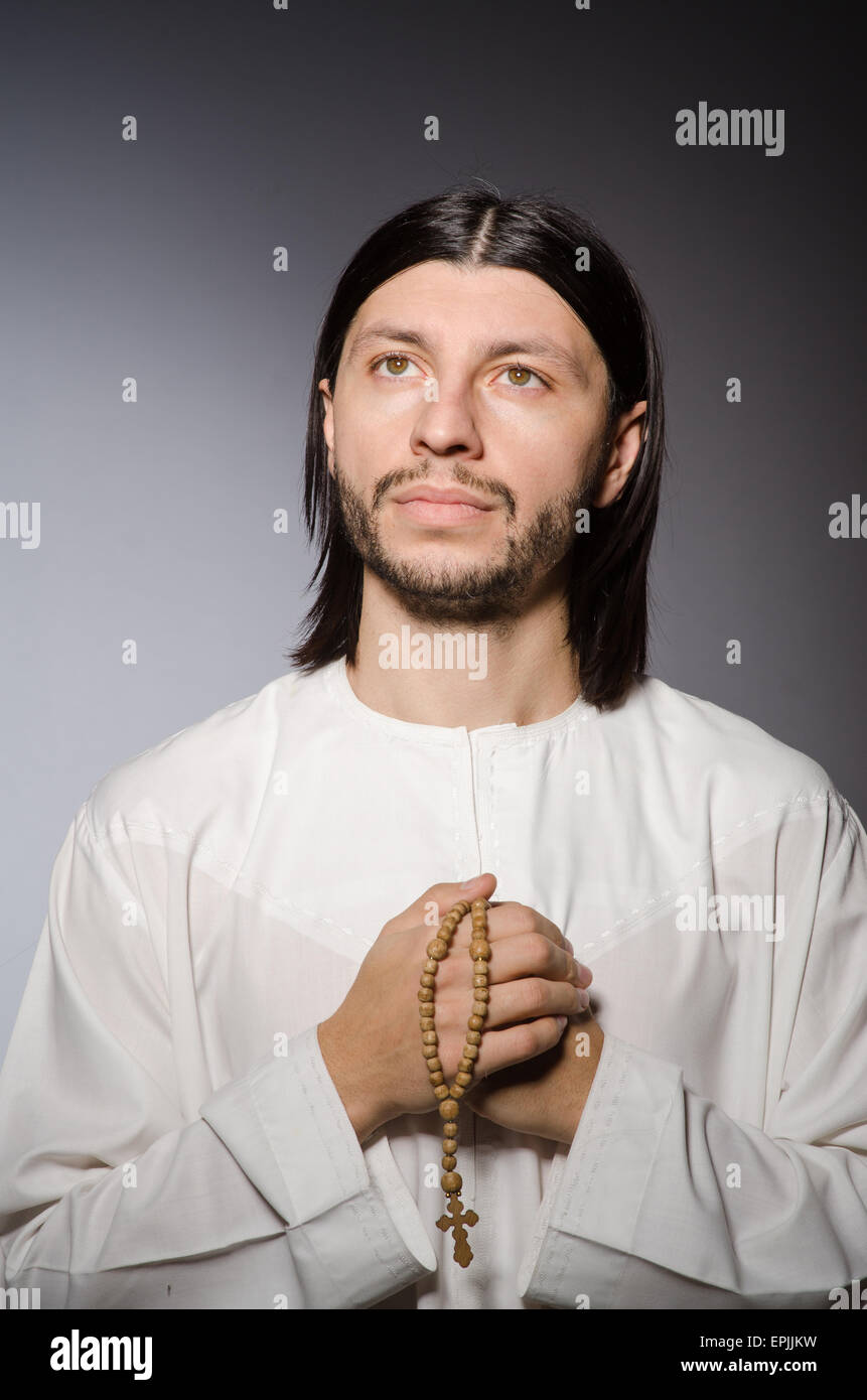 Priest man in religious concept Stock Photo - Alamy