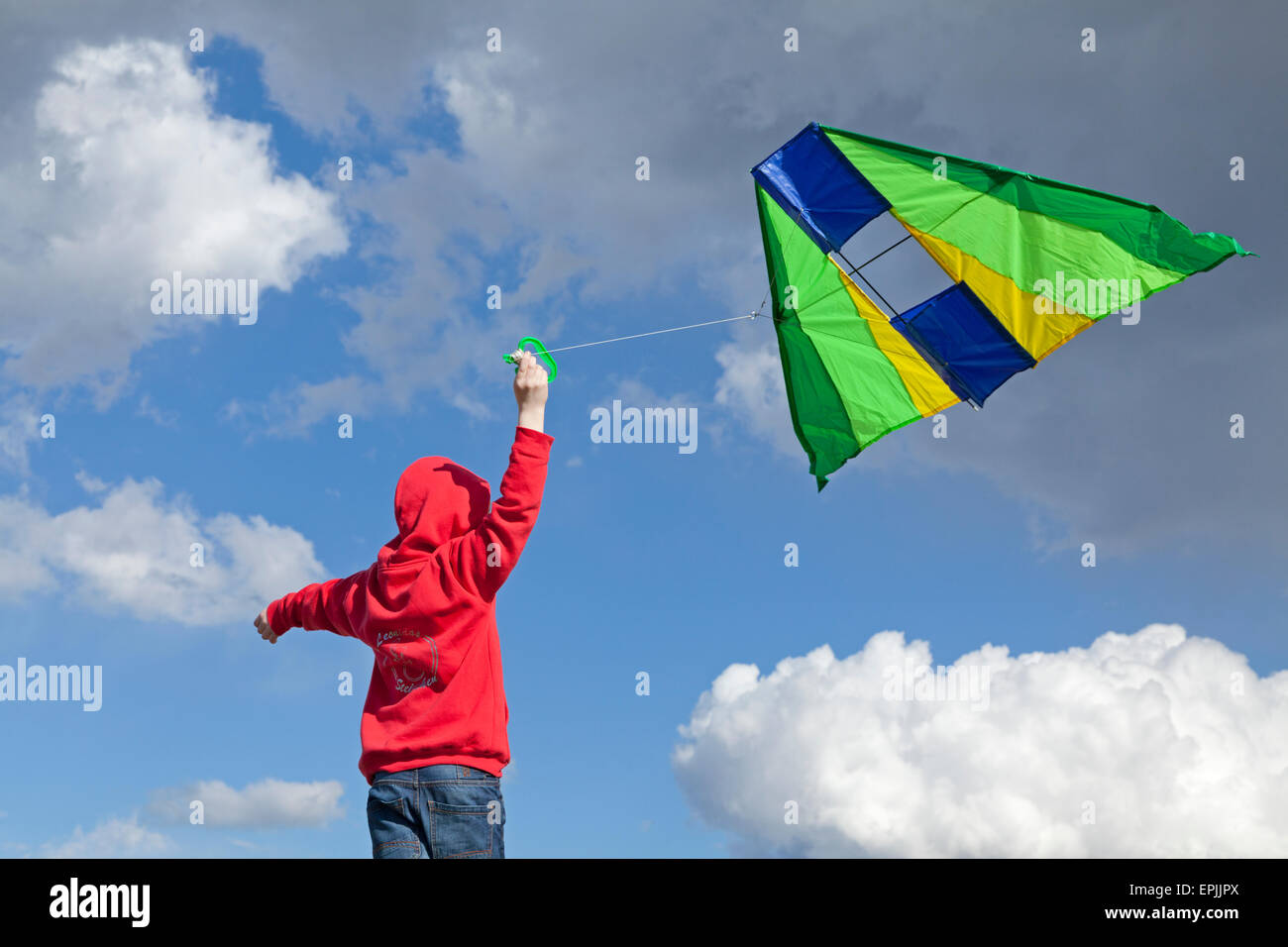 young boy flying a kite Stock Photo - Alamy