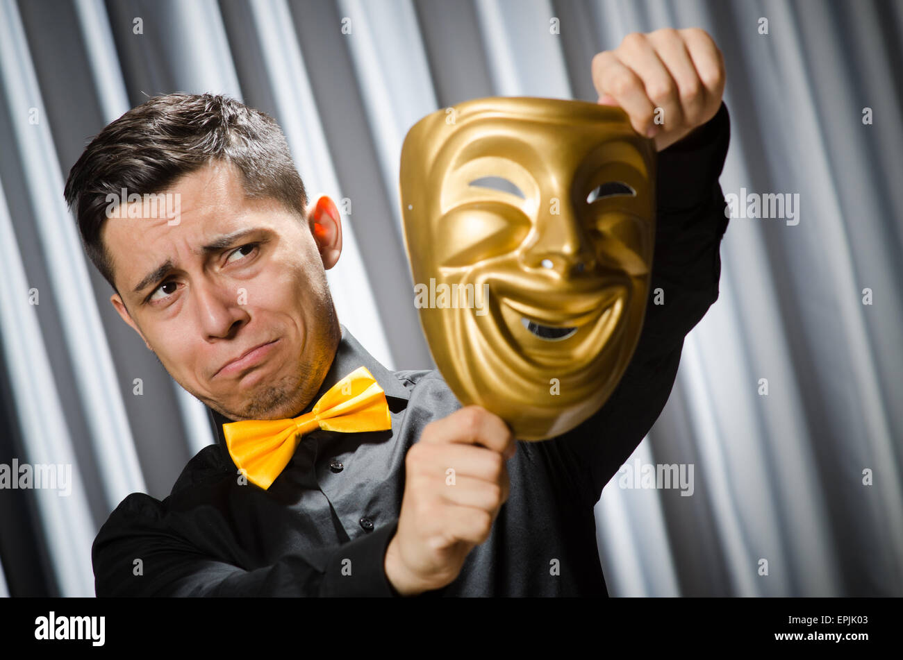 Funny concept with theatrical mask Stock Photo - Alamy