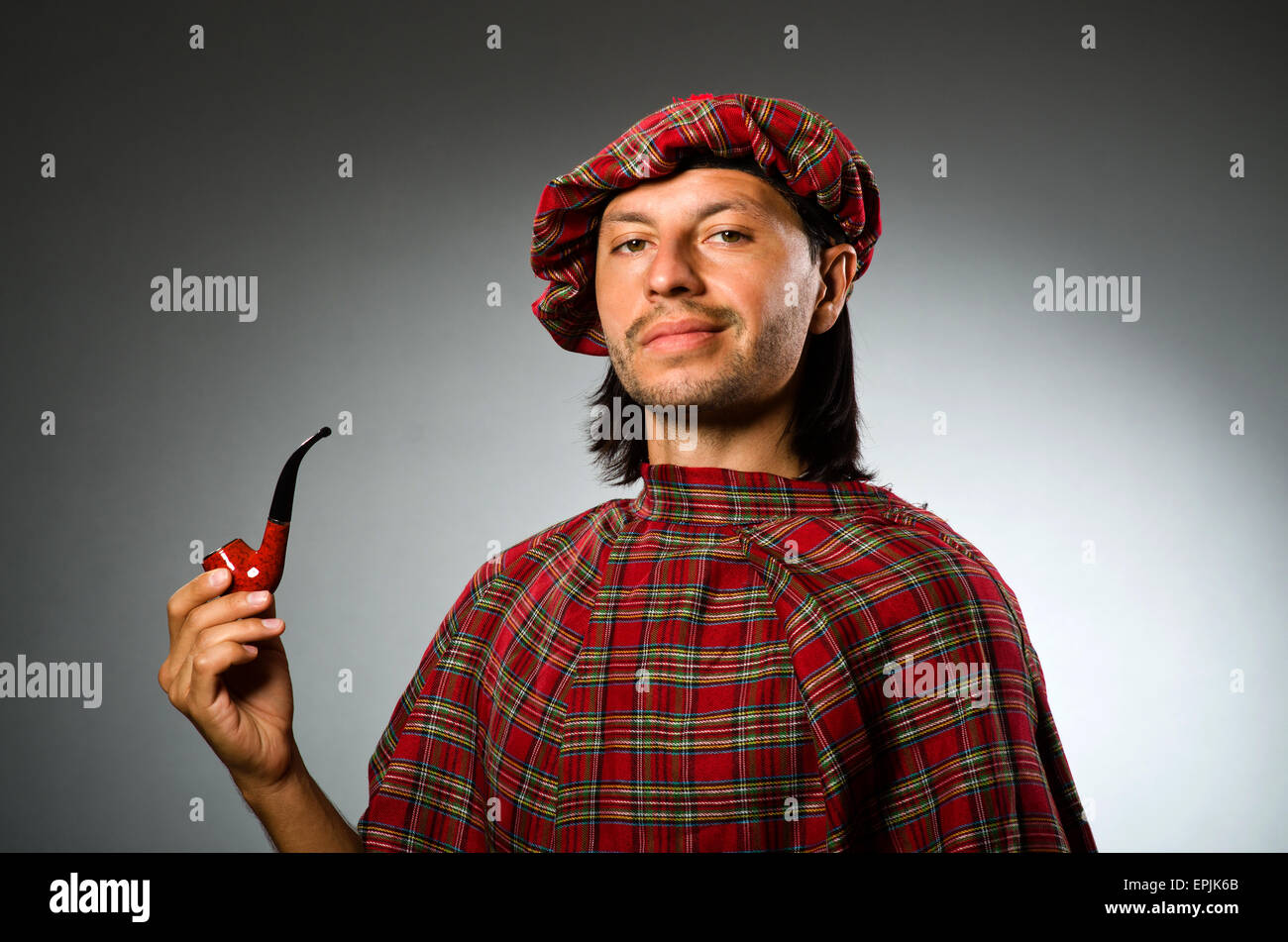 Funny scotsman with smoking pipe Stock Photo - Alamy