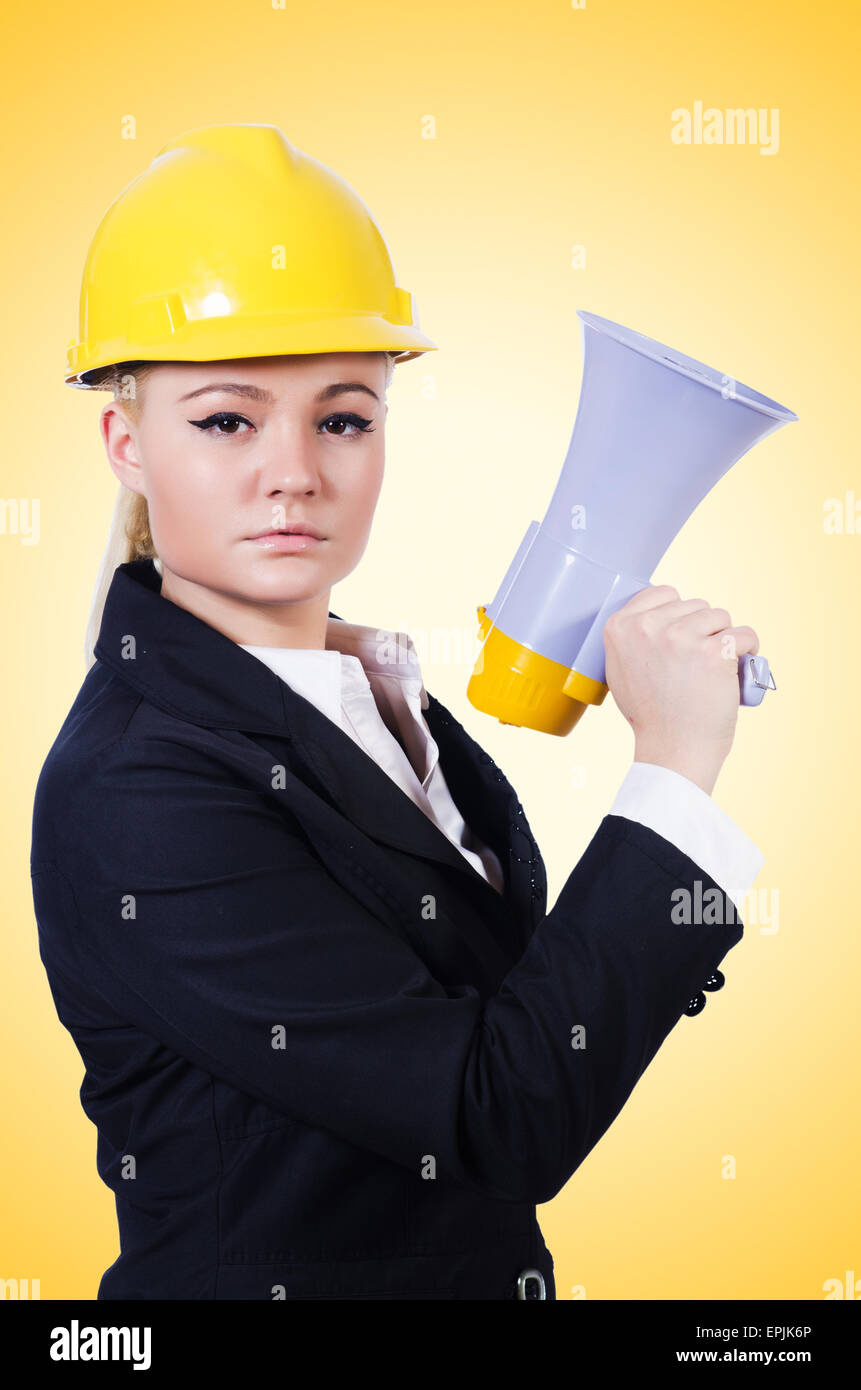Female construction worker with loudspeaker Stock Photo - Alamy