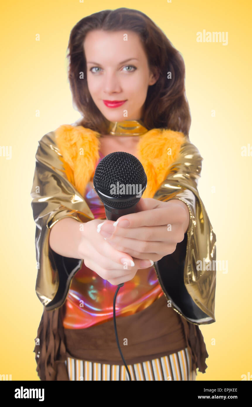 Woman in spanish clothing with mic Stock Photo - Alamy