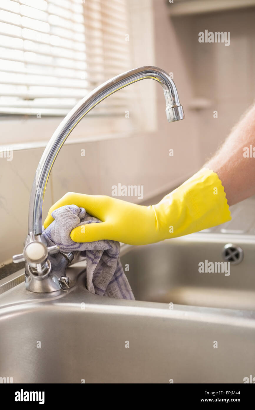 Hand cleaning a sink with cloth Stock Photo - Alamy