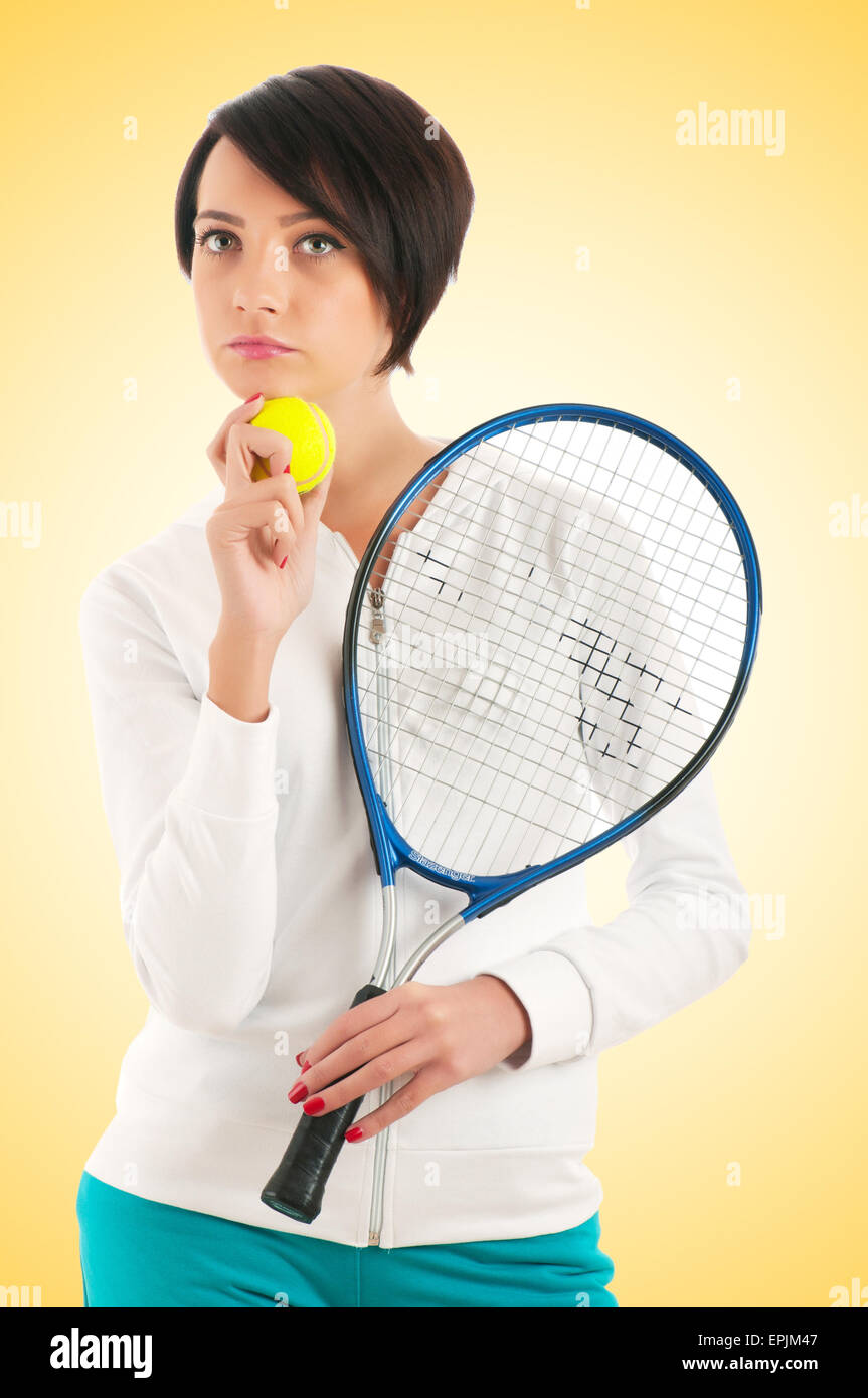 Young girl with tennis racket and bal isolated on white Stock Photo - Alamy