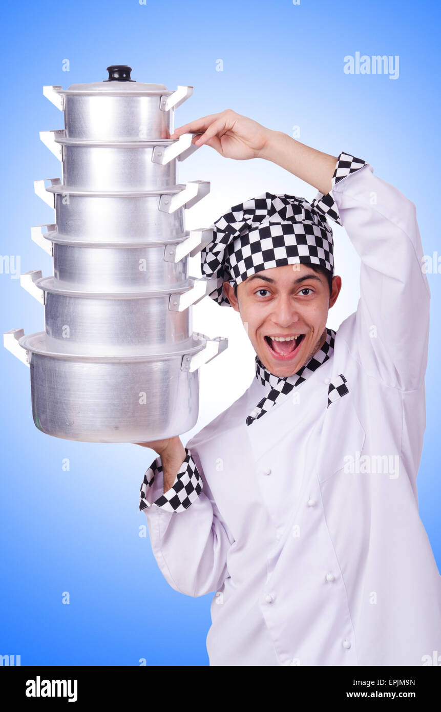 Cook with stack of pots on white Stock Photo - Alamy