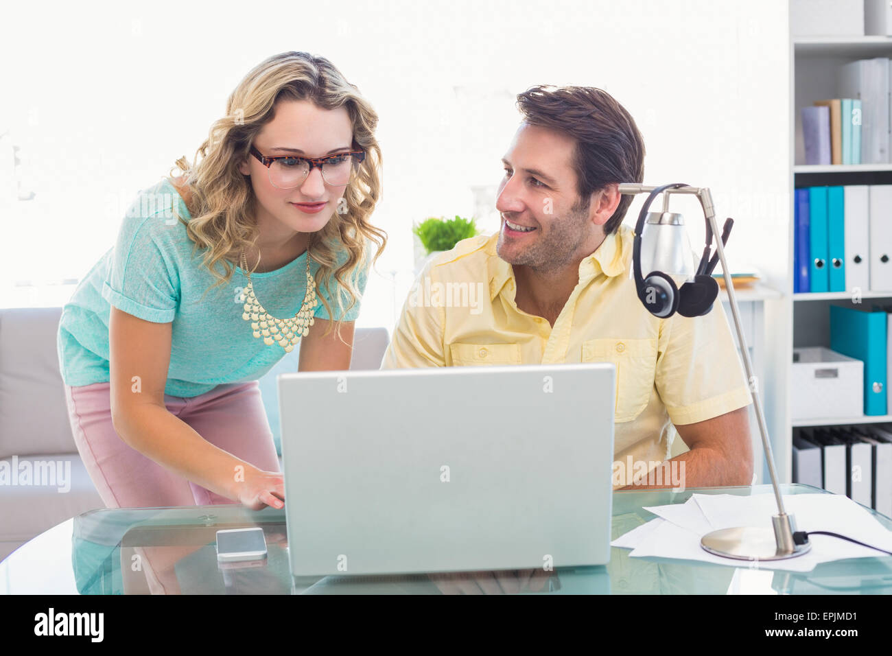 Creative business people working together on computer Stock Photo - Alamy