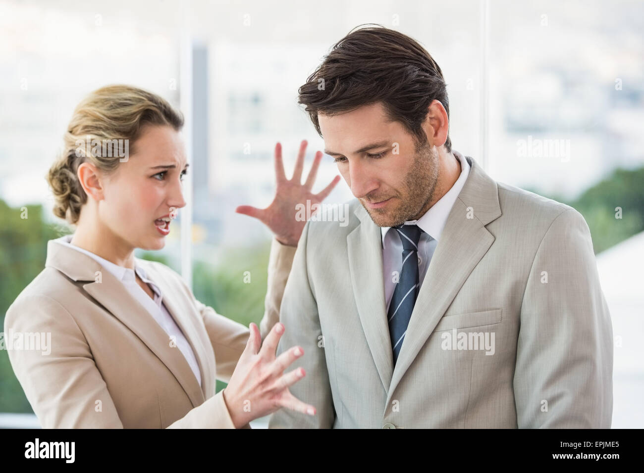 Woman shouting at male colleague Stock Photo - Alamy