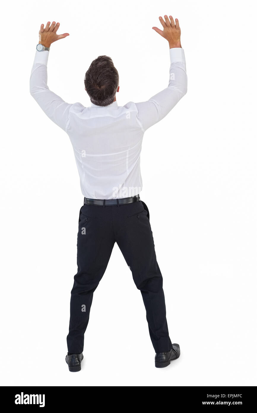 Rear view of a businessman pushing Stock Photo - Alamy