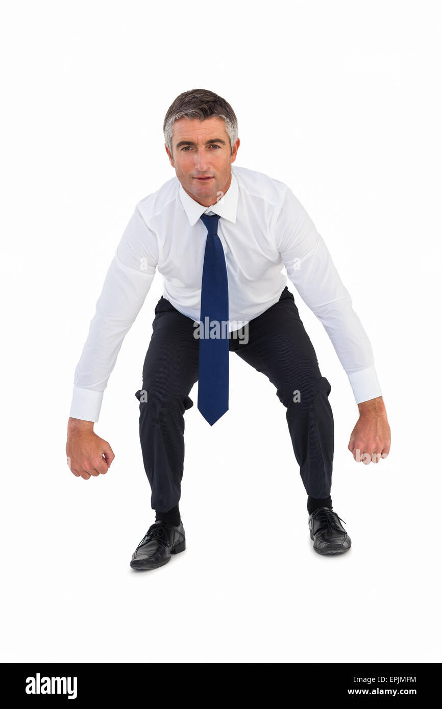 Businessman bending and clenching fists Stock Photo - Alamy