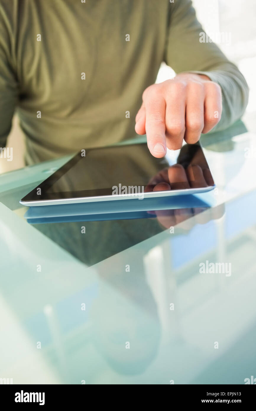Man touching his digital tablet Stock Photo - Alamy