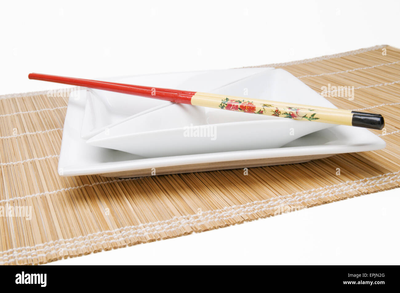 chopsticks on angular dish parallel Stock Photo - Alamy