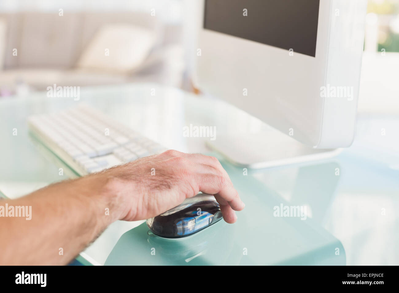Businessman using the computer mouse Stock Photo - Alamy