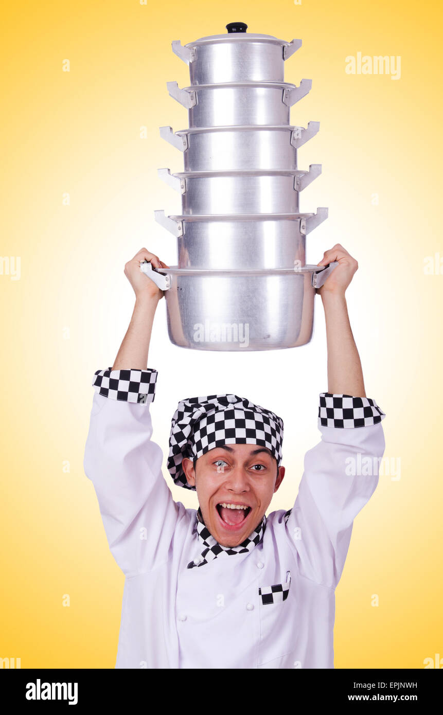 Cook with stack of pots on white Stock Photo - Alamy