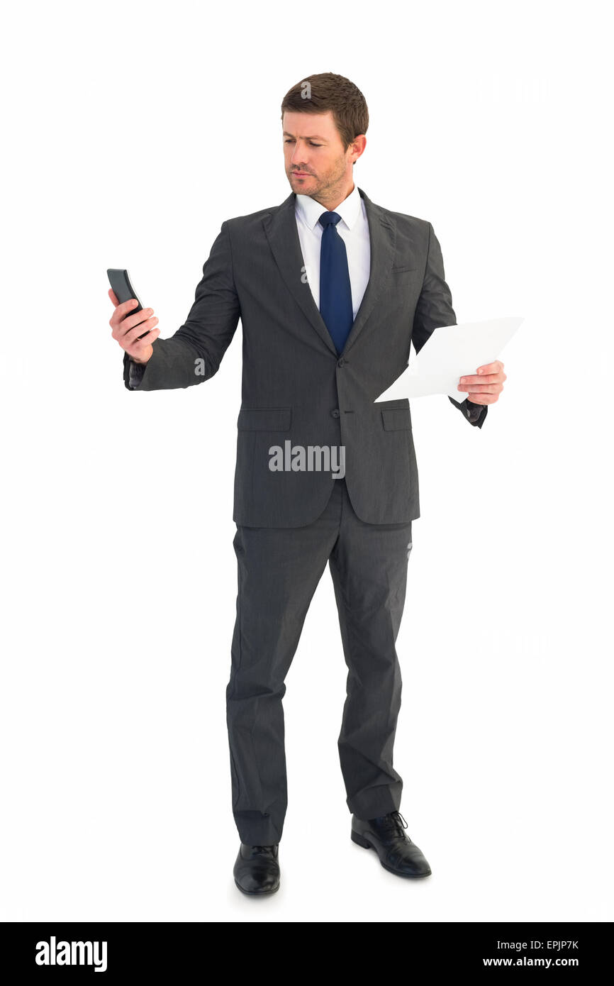 Businessman sending text holding page Stock Photo - Alamy Businessman sending text holding page Stock Photo - Alamy