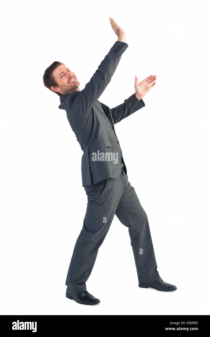 Businessman with his hands up Stock Photo - Alamy