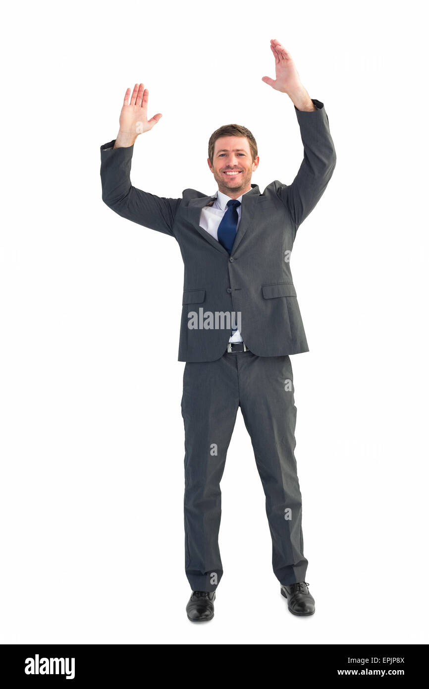 Happy businessman with hands up Stock Photo - Alamy