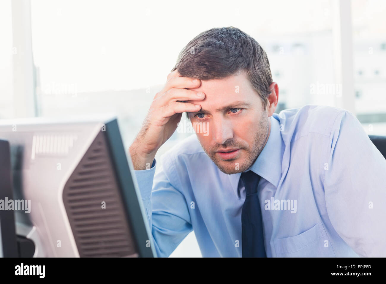 Concentrate businessman looking at his computer Stock Photo - Alamy