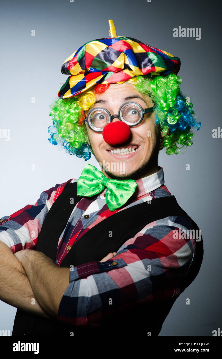 Funny clown against the dark background Stock Photo - Alamy