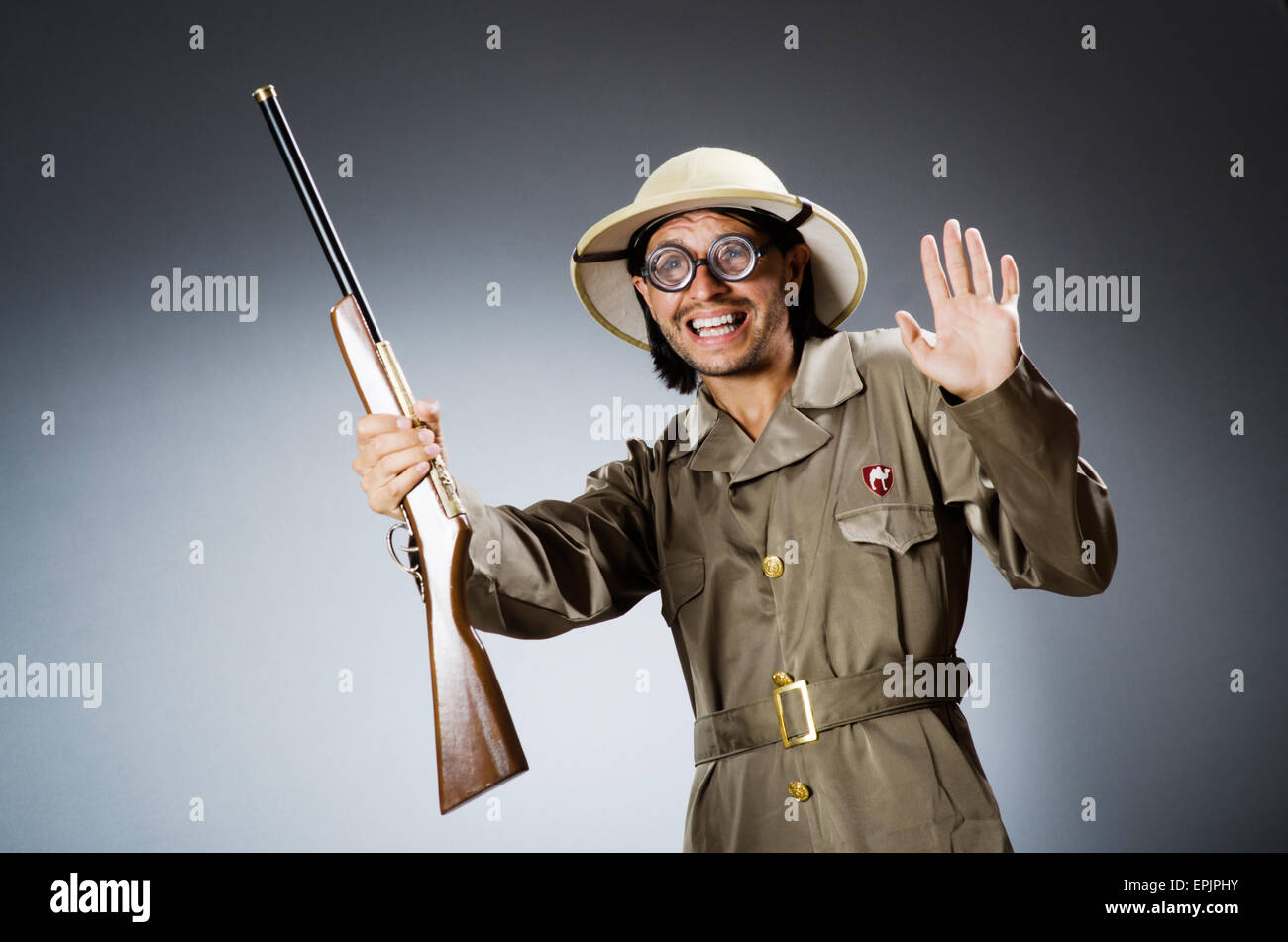 Funny safari hunter with rifle Stock Photo - Alamy