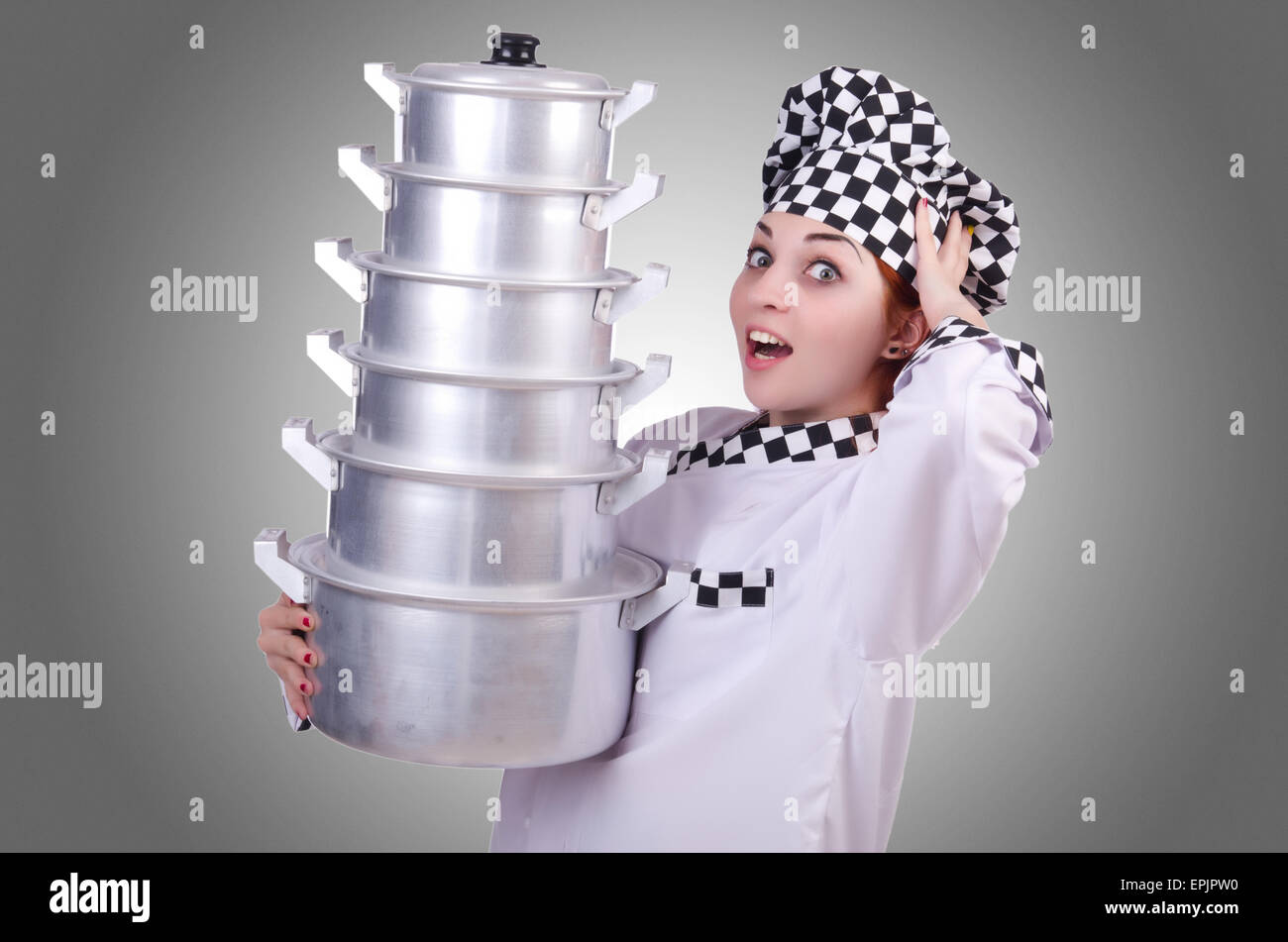 Cook with stack of pots on white Stock Photo - Alamy