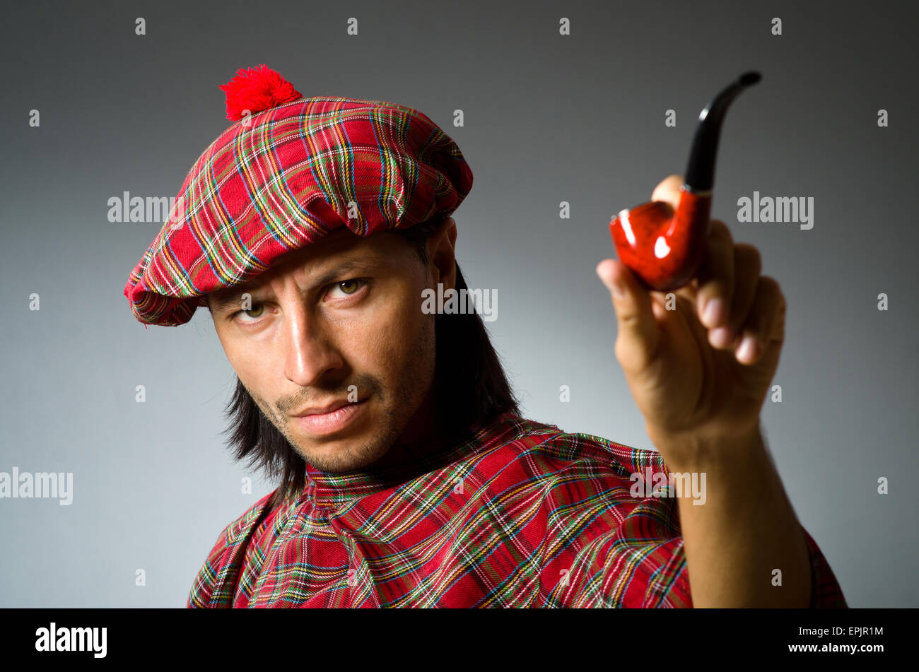 Funny scotsman with smoking pipe Stock Photo - Alamy