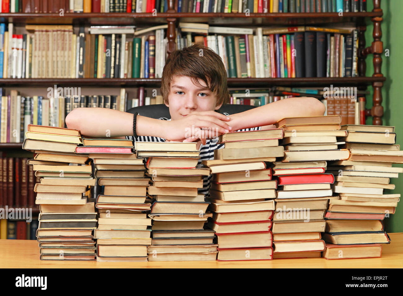 Boy with books hi-res stock photography and images - Alamy