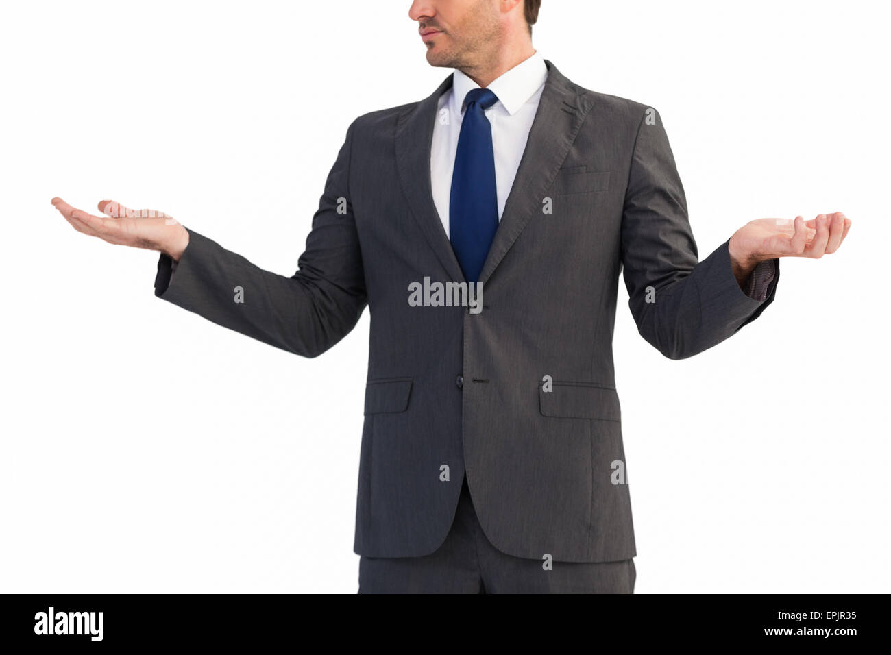 Businessman presenting with his hands Stock Photo - Alamy