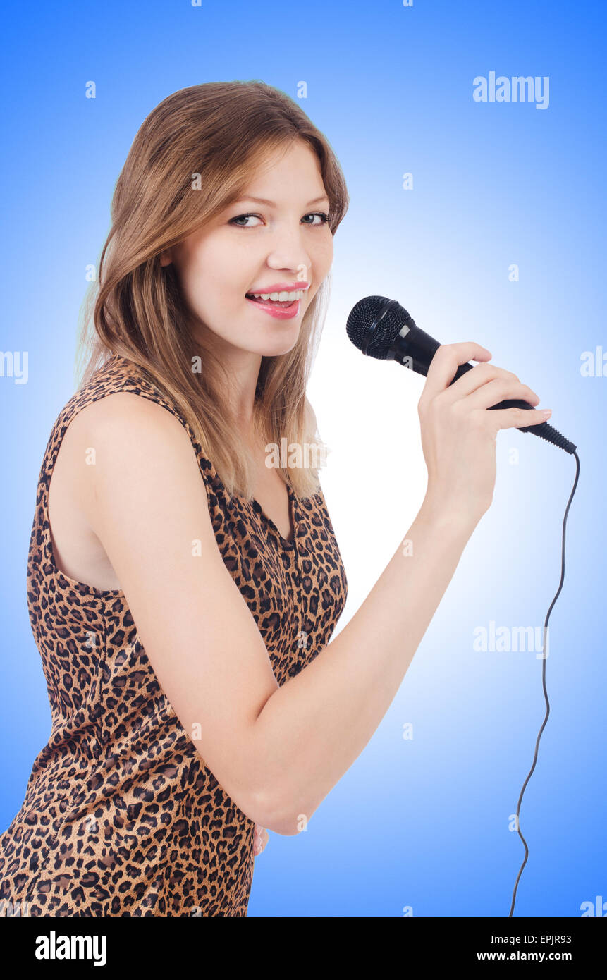 Woman singer with microphone on white Stock Photo - Alamy