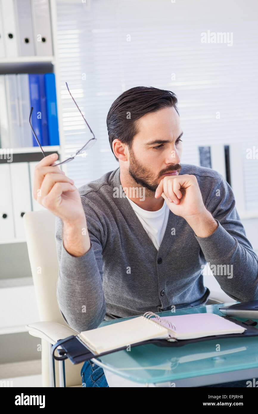 Young businessman organizing his schedule at his desk Stock Photo - Alamy