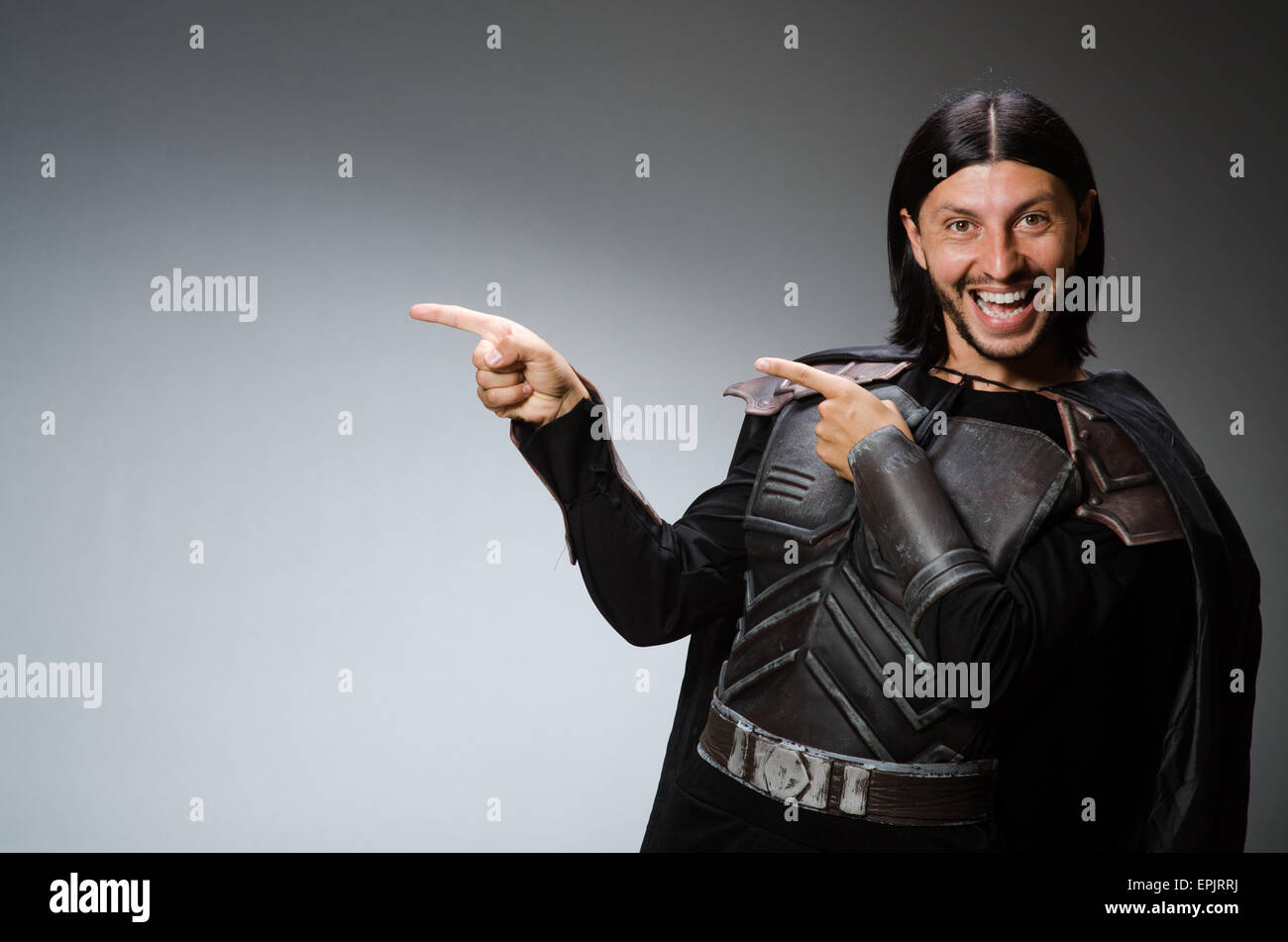 Funny knight against dark background Stock Photo - Alamy