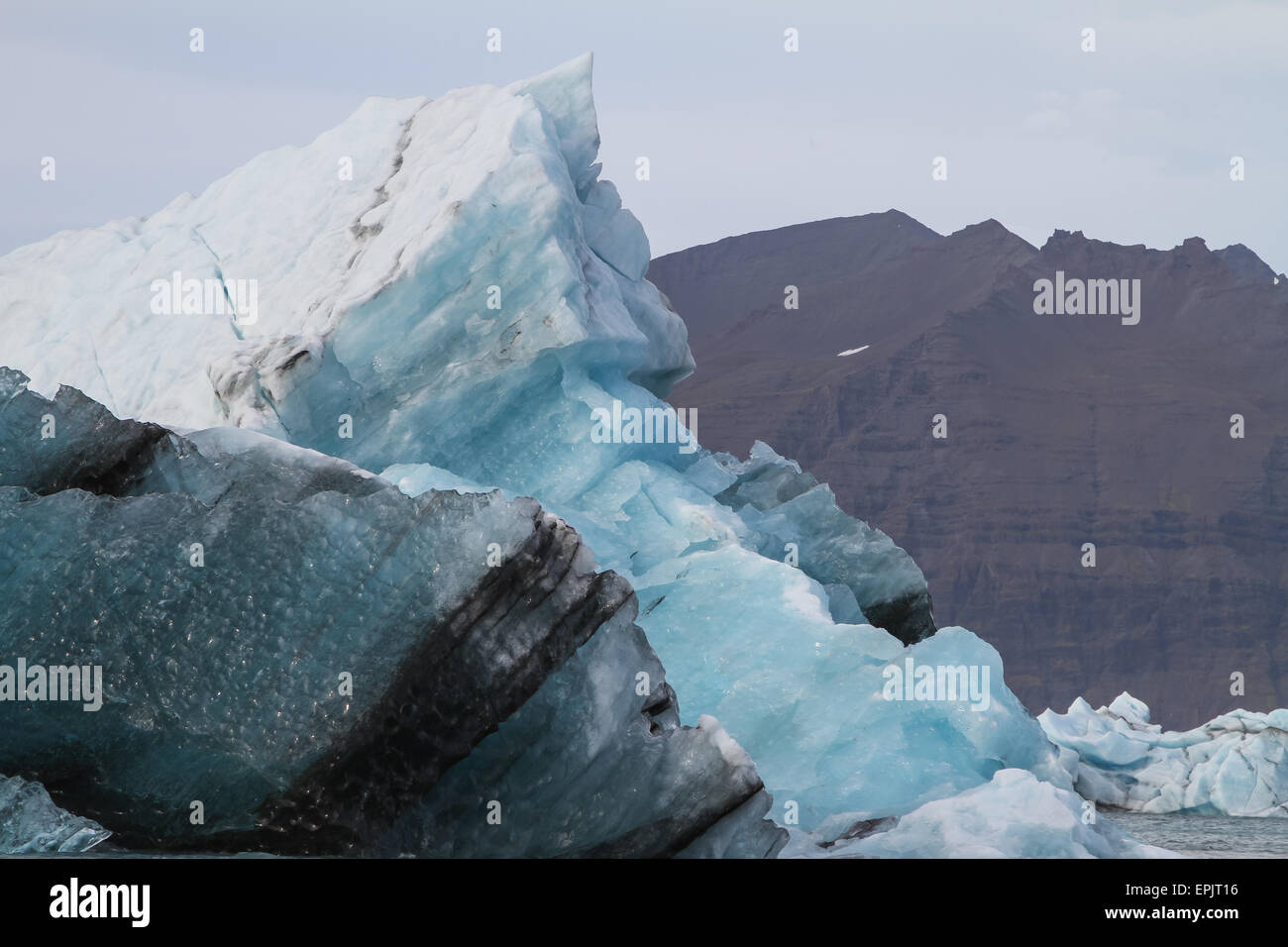 Iceberg and mountain Stock Photo - Alamy