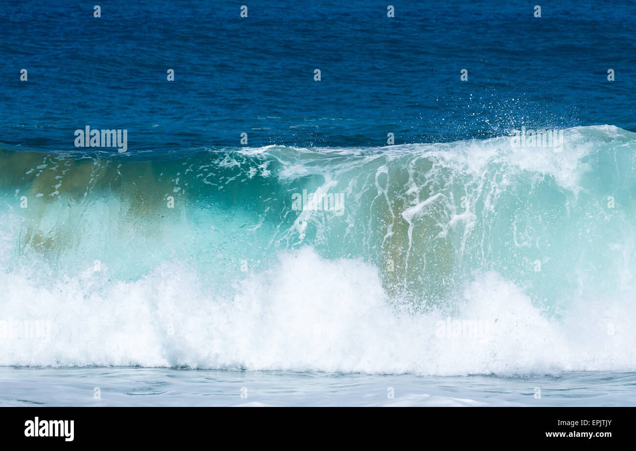 Frozen motion of large wave on beach Stock Photo - Alamy
