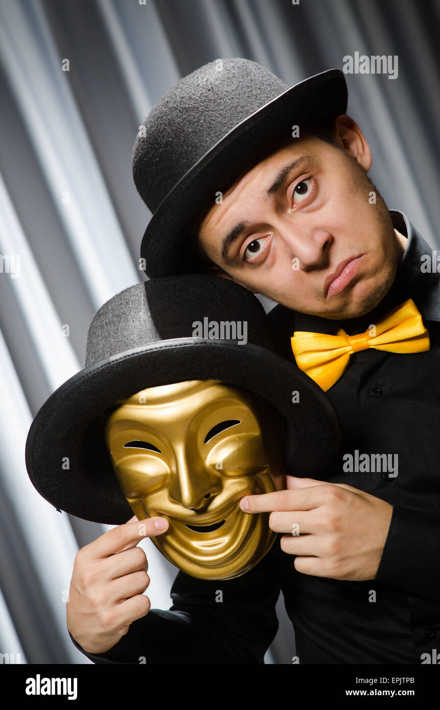Funny concept with theatrical mask Stock Photo - Alamy